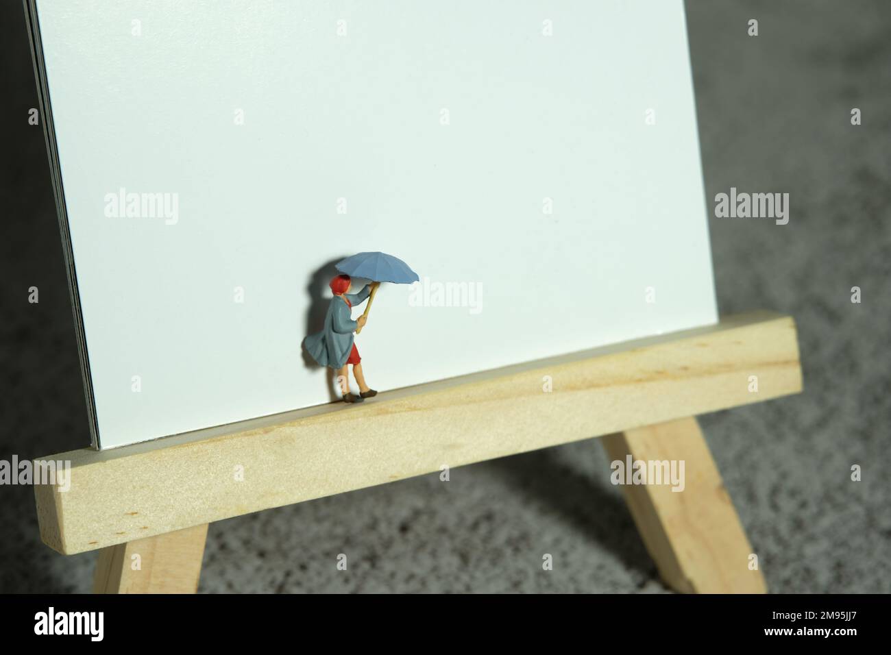 Miniature people toy figure photography. Women standing above wooden ...