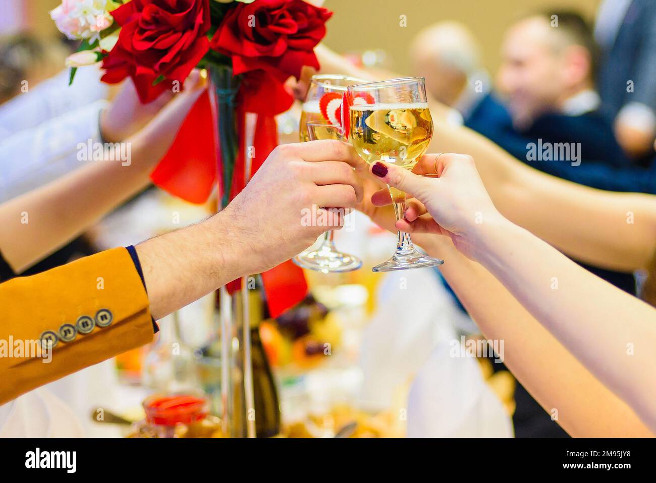 people celebrate and make a toast with glasses of wine in hand Stock ...