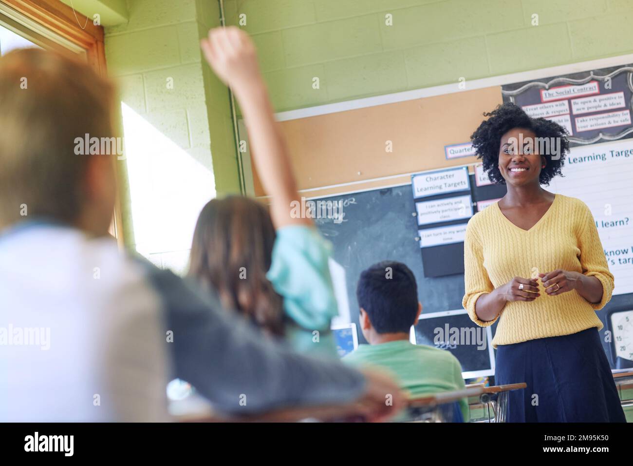 Learning, teacher and student with question in classroom or school ...