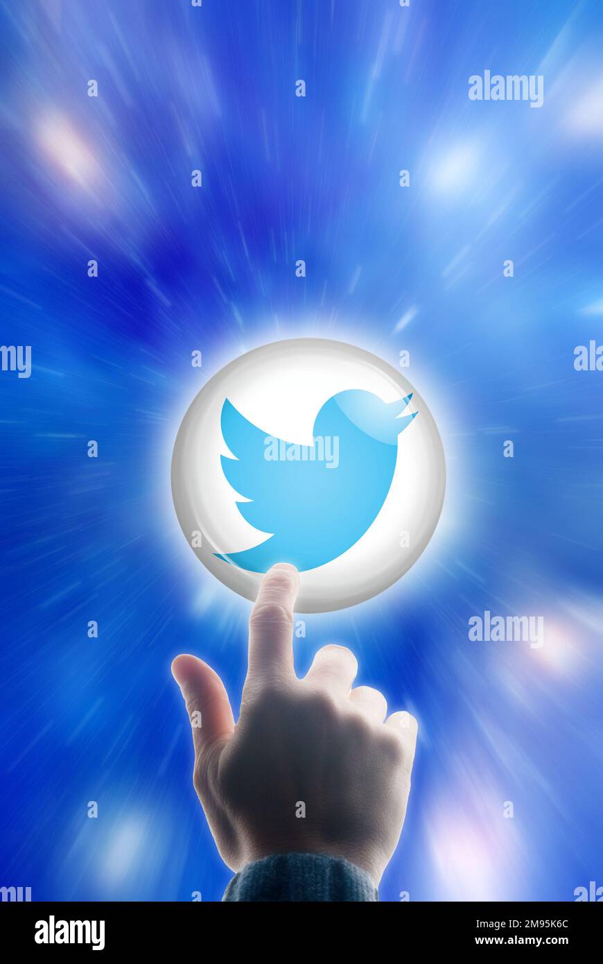 man finger touching a button with logo of Twitter Stock Photo - Alamy