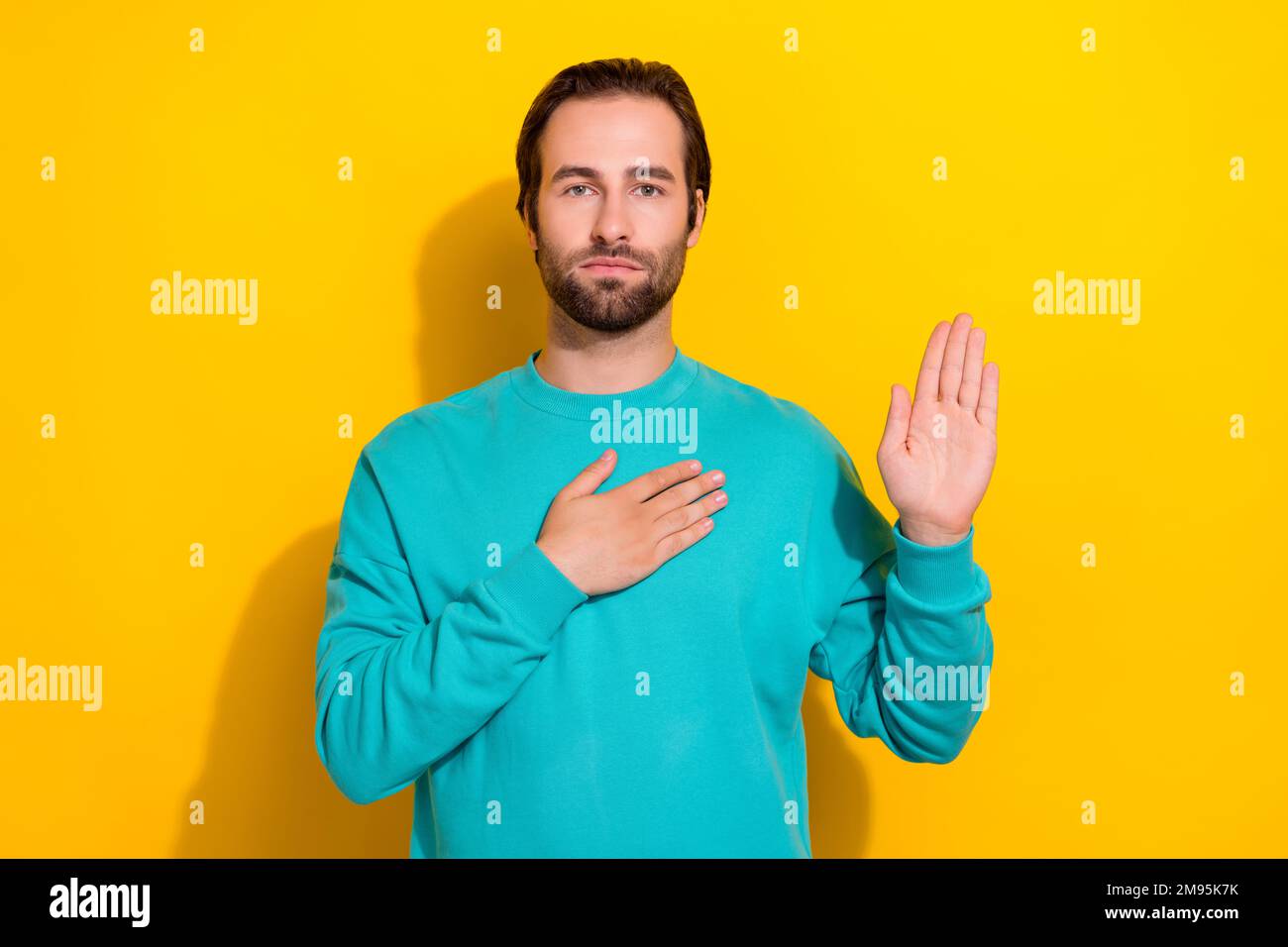 Photo of honest oath brunet hair young serious man touch chest palm ...