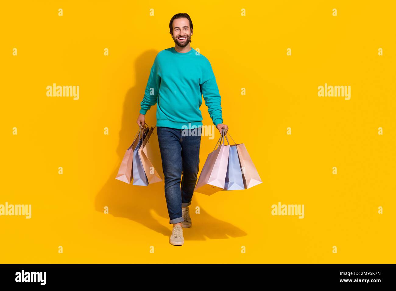 Full length photo of good mood cute guy dressed teal outfit holding ...