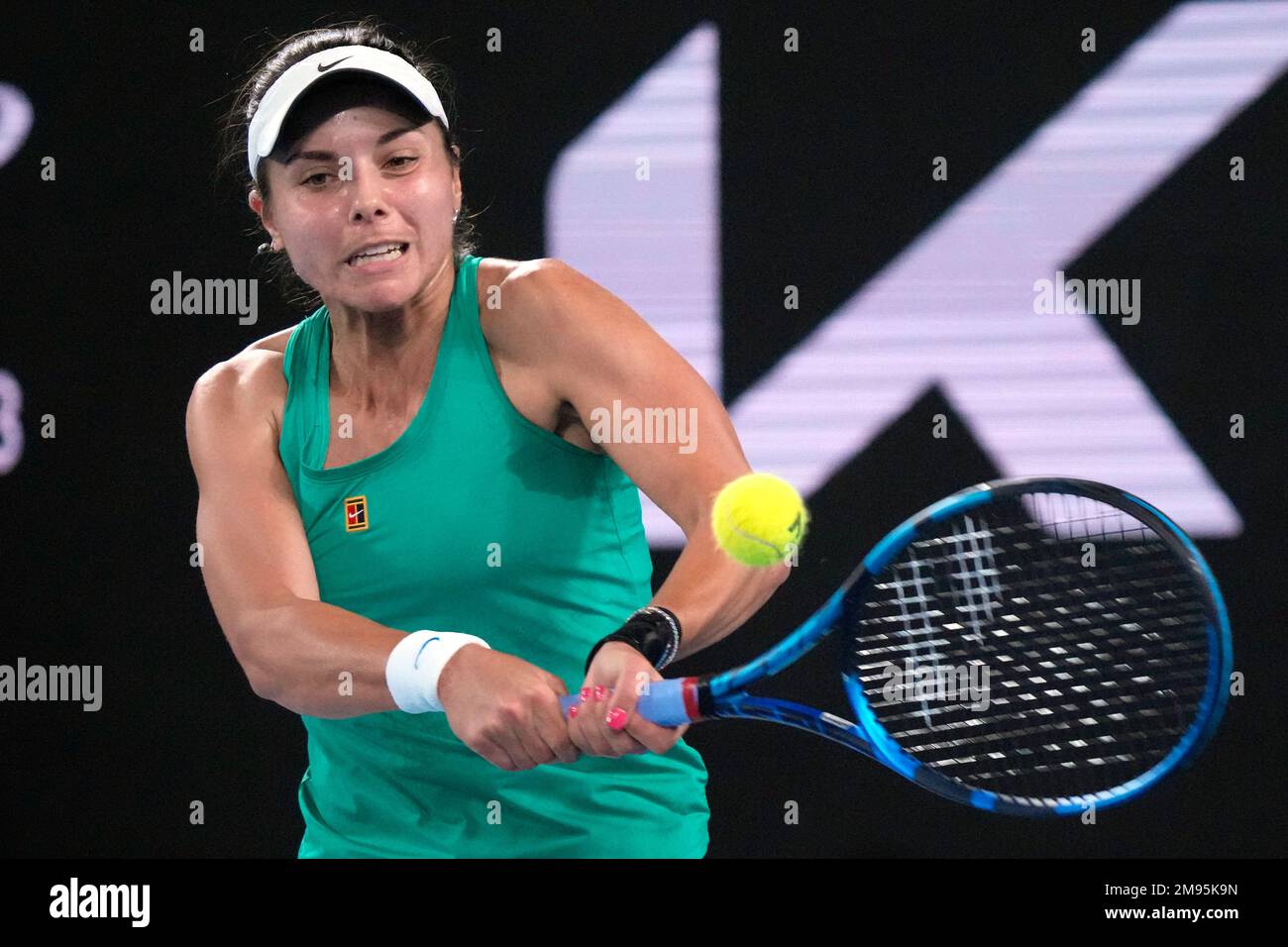 Viktoriya Tomova of Bulgaria plays a backhand return to Belinda Bencic ...
