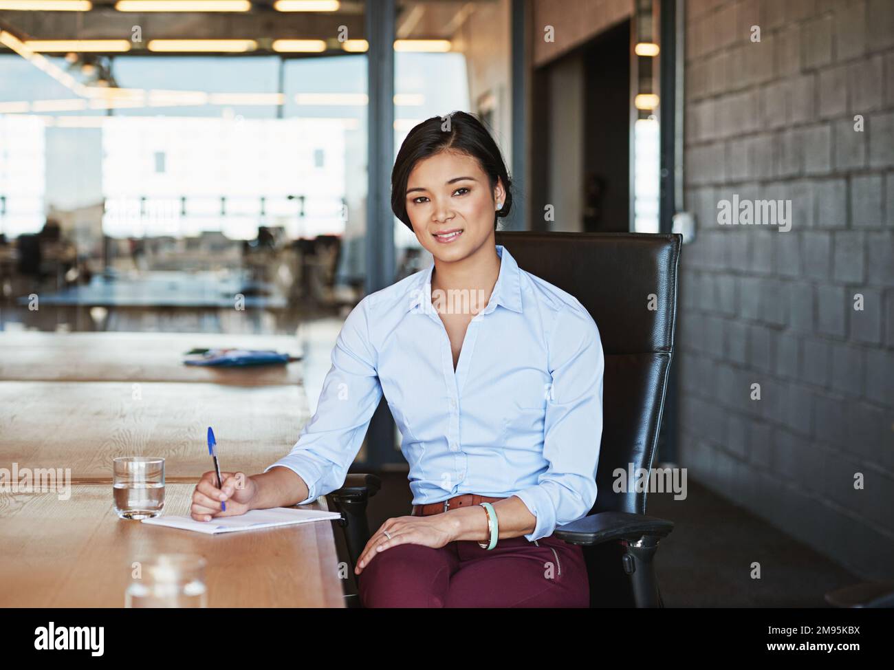 Business woman, portrait smile and writing for planning, strategy or ...