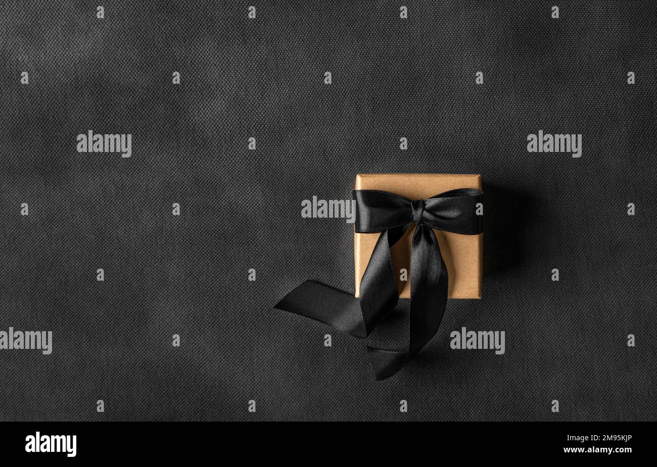 Small box with black ribbon Stock Photo - Alamy