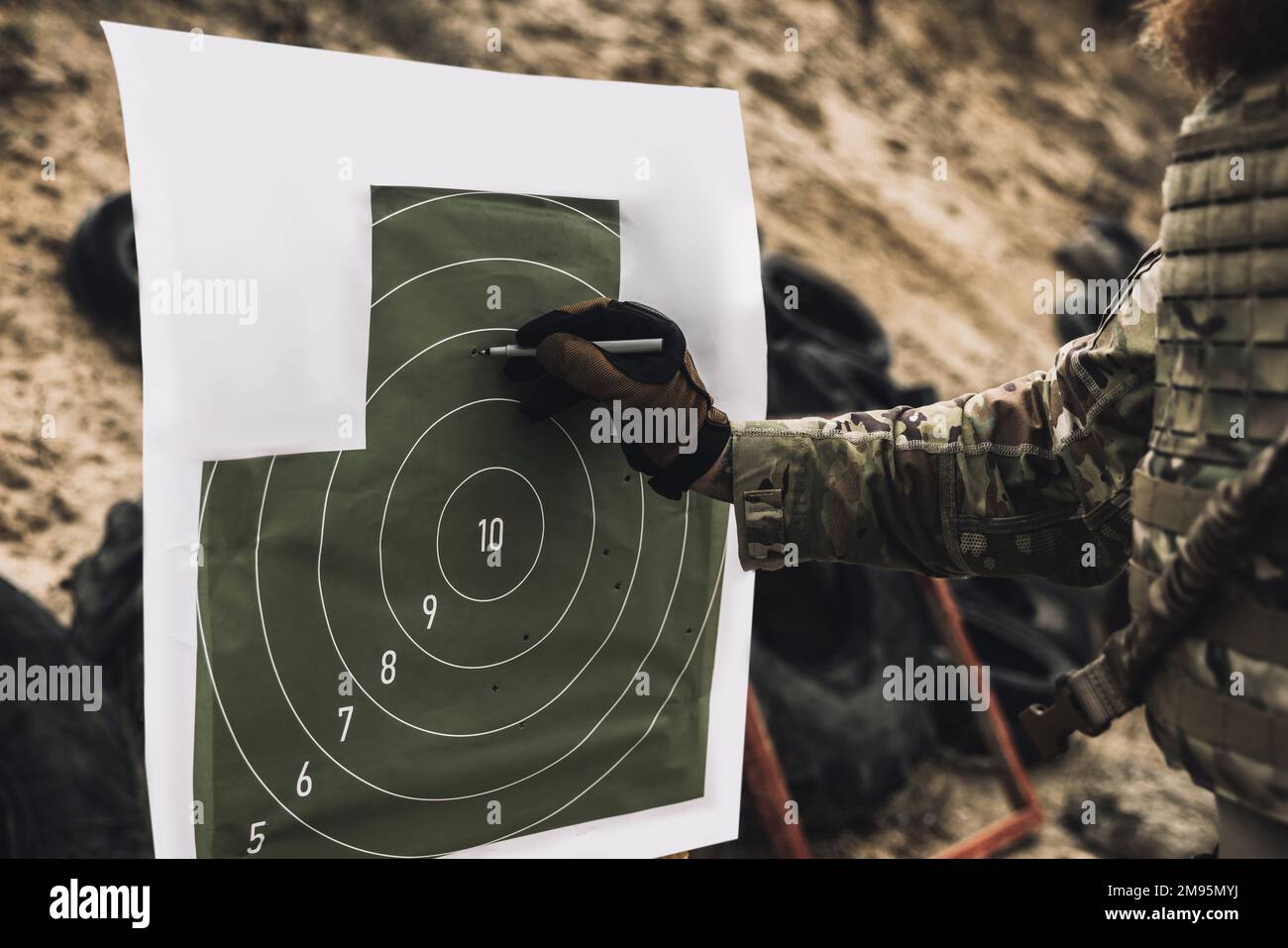 Soldier marking the target for shooting Stock Photo - Alamy