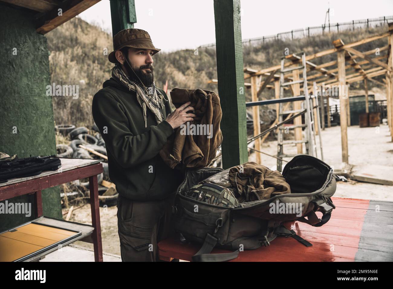 New soldier taking military uniform from the bag Stock Photo - Alamy