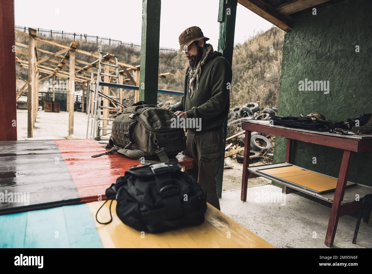 New soldier taking military uniform from the bag Stock Photo - Alamy
