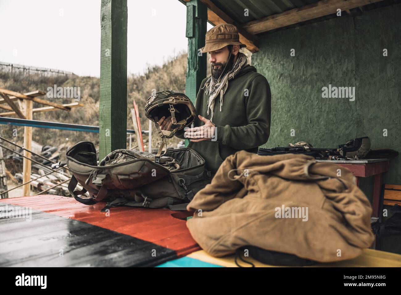 New soldier taking military uniform from the bag Stock Photo - Alamy
