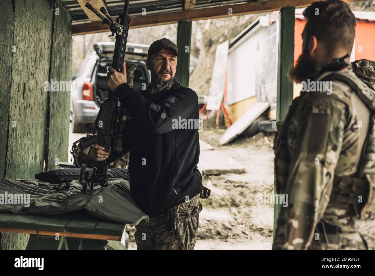 New soldier in a military camp learning to use rifle Stock Photo - Alamy