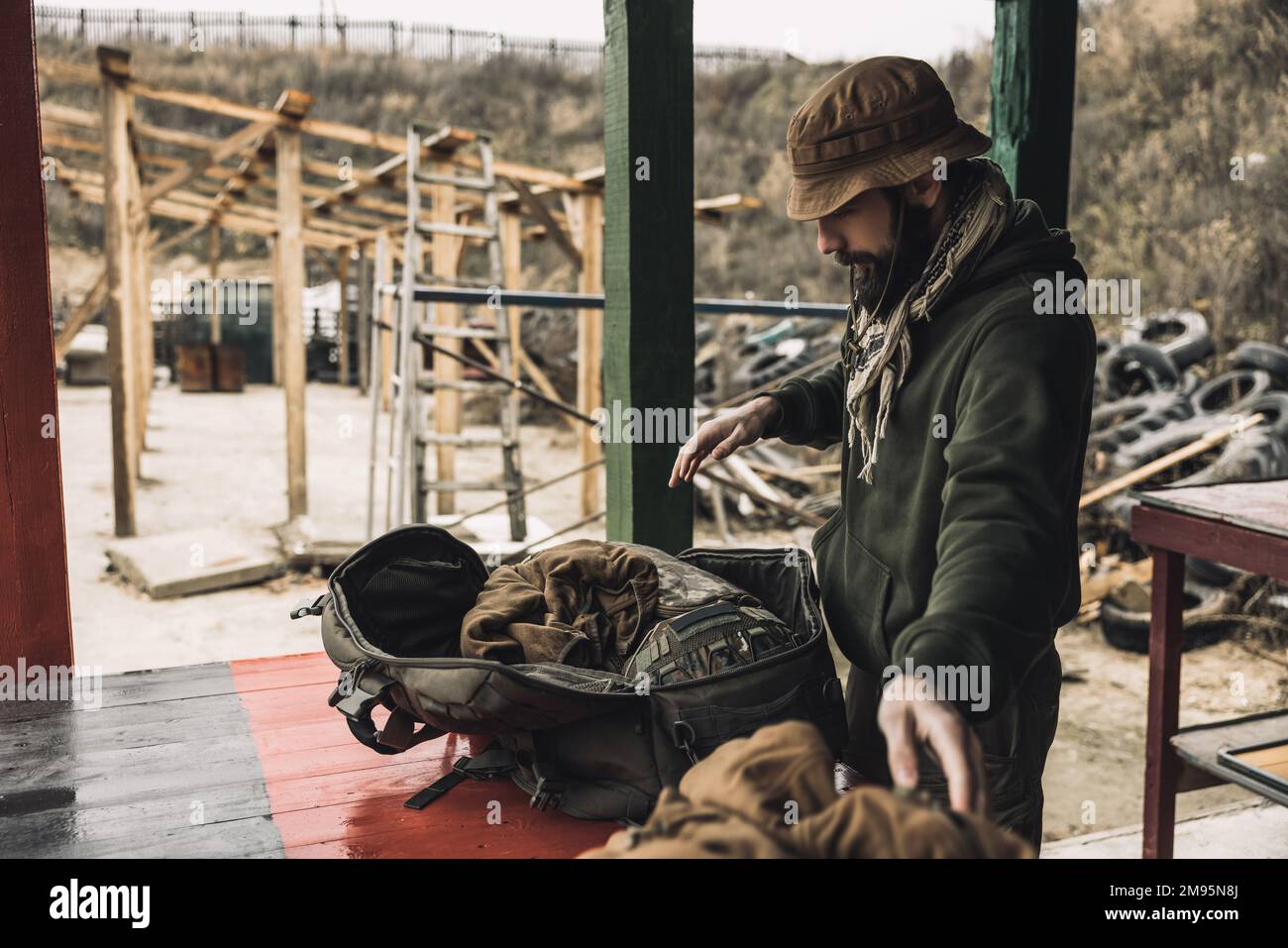 New soldier taking military uniform from the bag Stock Photo - Alamy