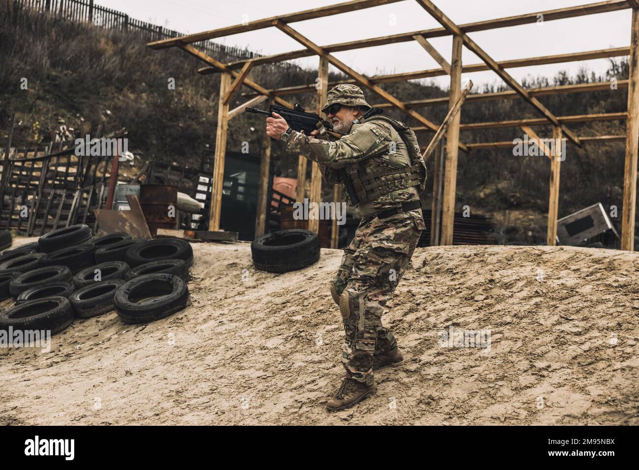 New soldier in a military camp learning to use rifle Stock Photo - Alamy