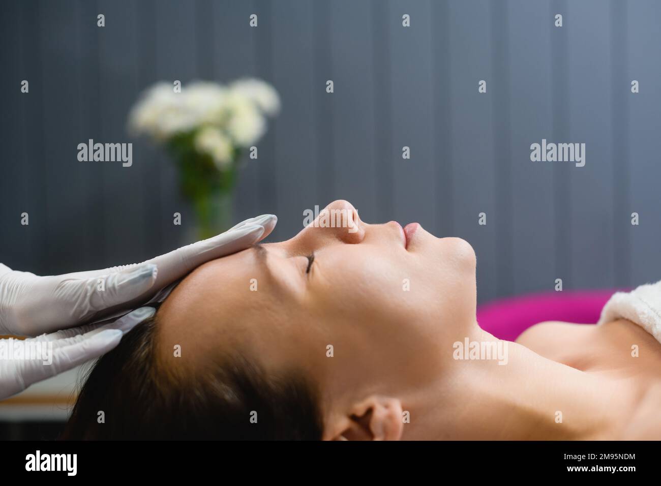 Beauty massage treatment to forehead skin, cosmetologist take care of ...