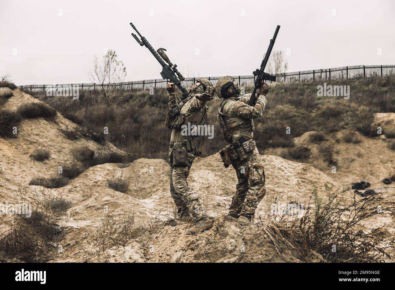 Two soldiers with their rifles shooting Stock Photo - Alamy