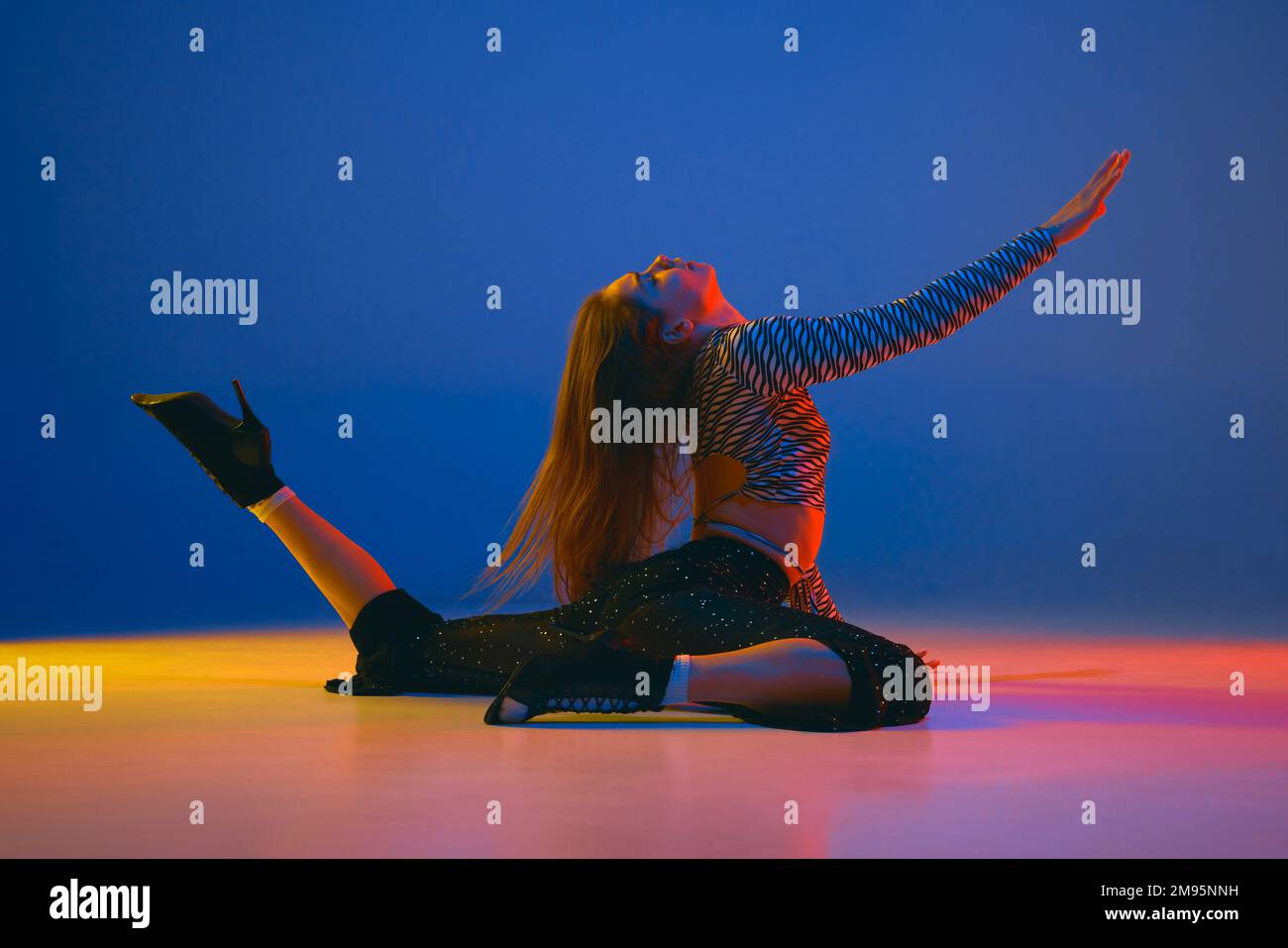 Expressive. Portrait of young girl performing high heel dance in ...