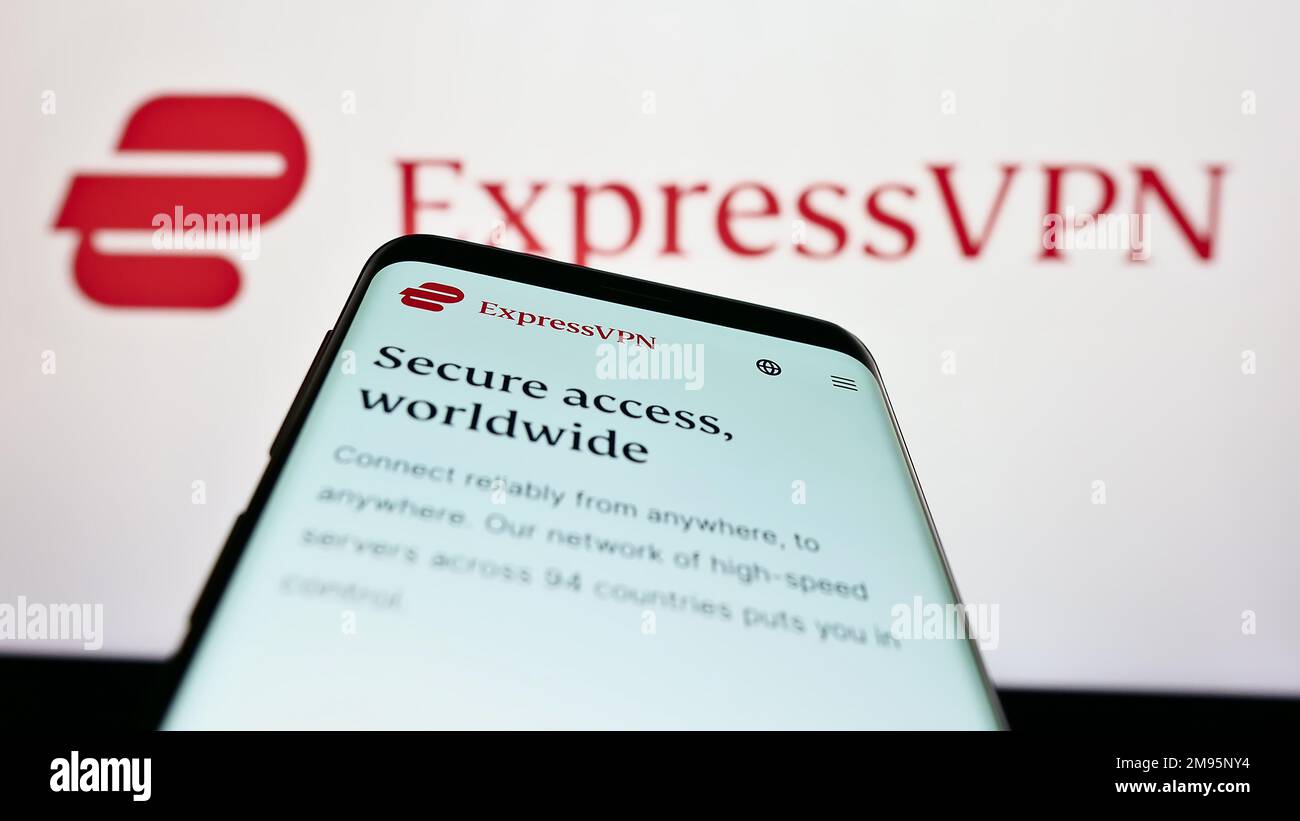 Mobile phone with webpage of VPN service company ExpressVPN on screen ...