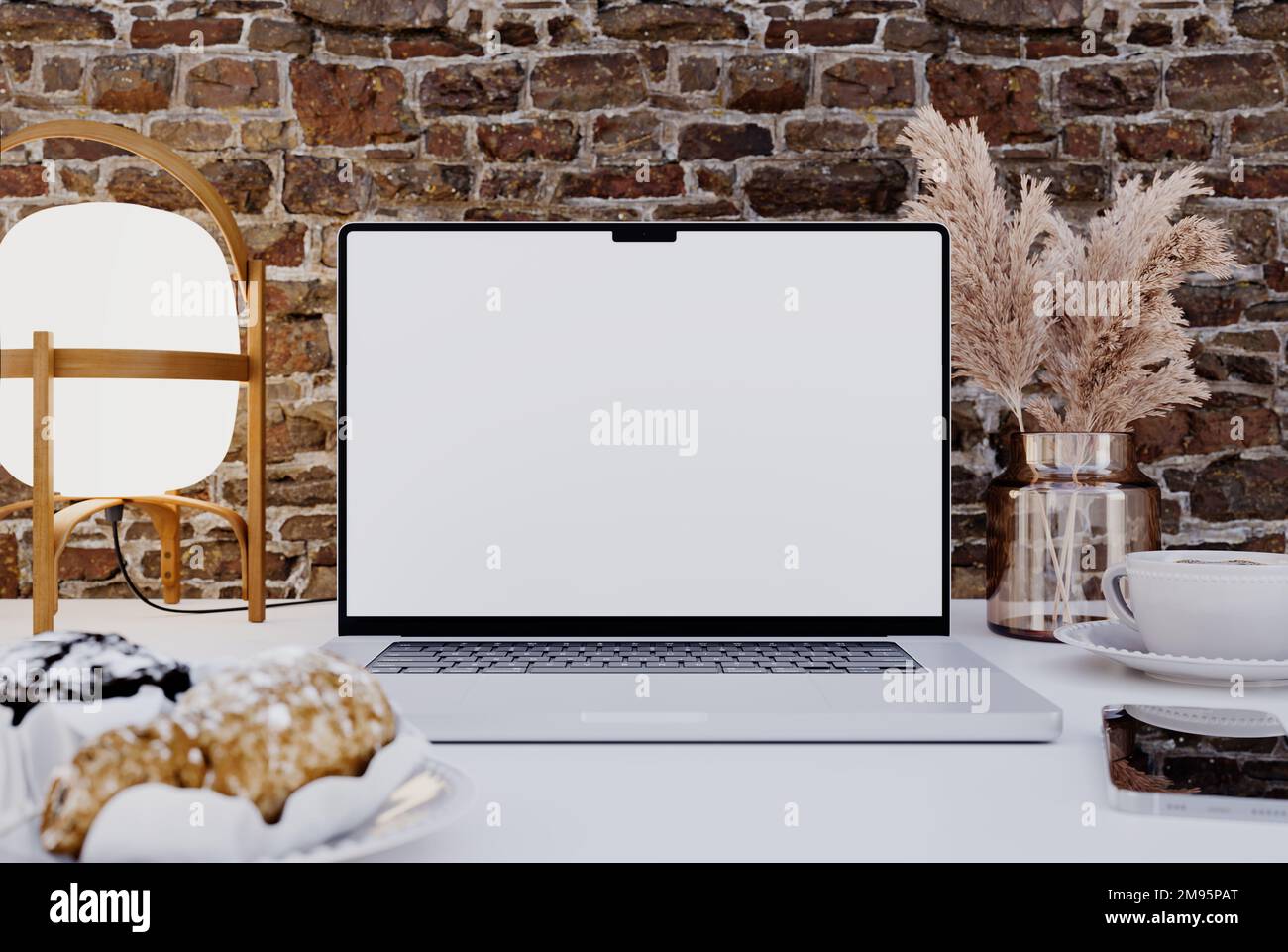 Stylish workspace, laptop computer mock up, croissant and coffee, plant ...