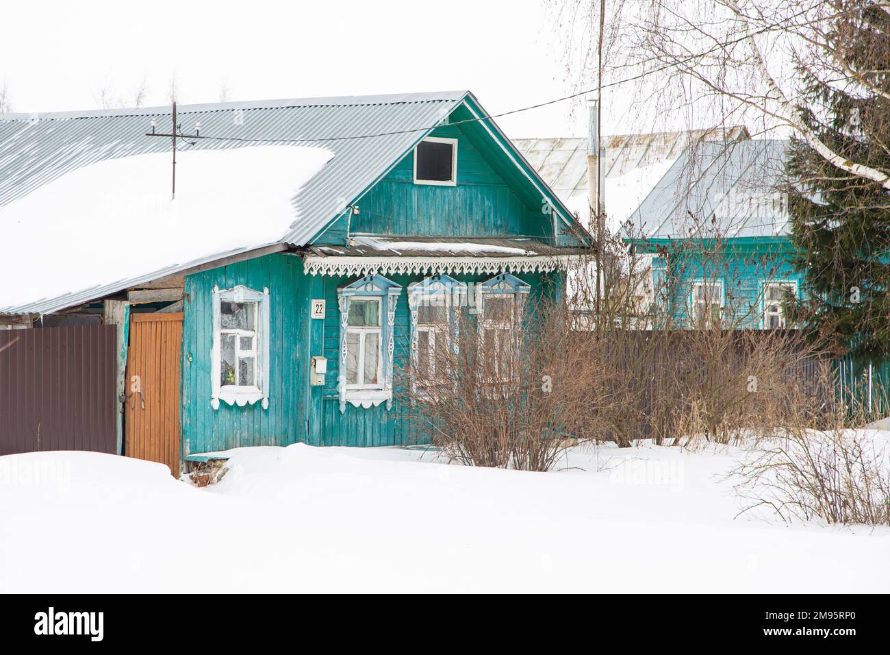 A Russian wood house covered in snow Stock Photo - Alamy