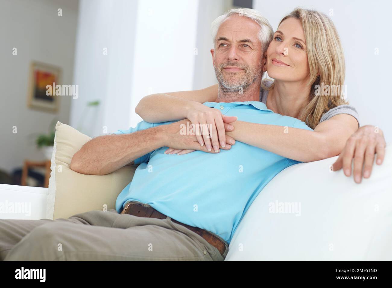 Senior couple, thinking and retirement hug with love, care and support ...