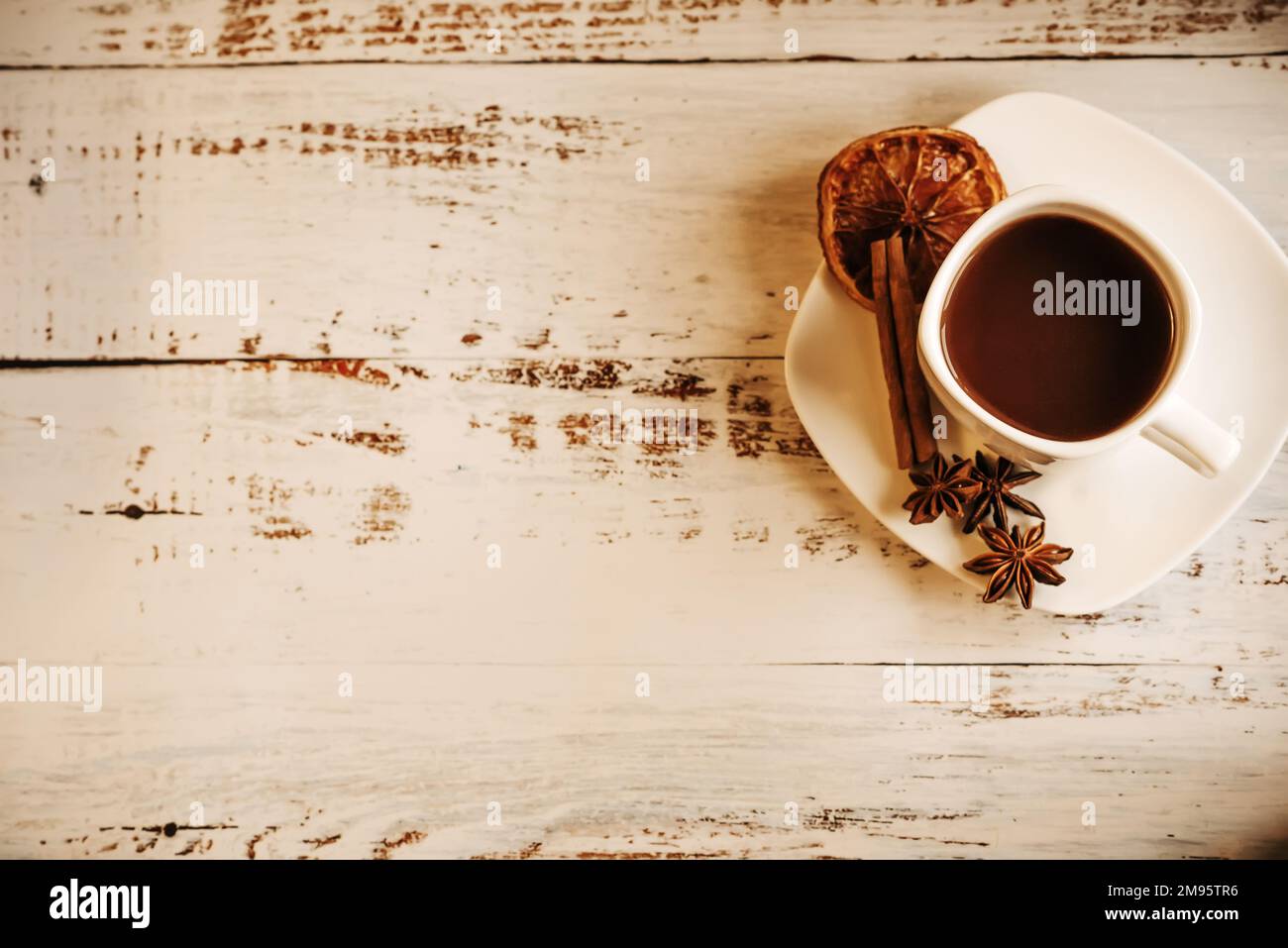 Coffee cup with spices wooden table texture Stock Photo - Alamy
