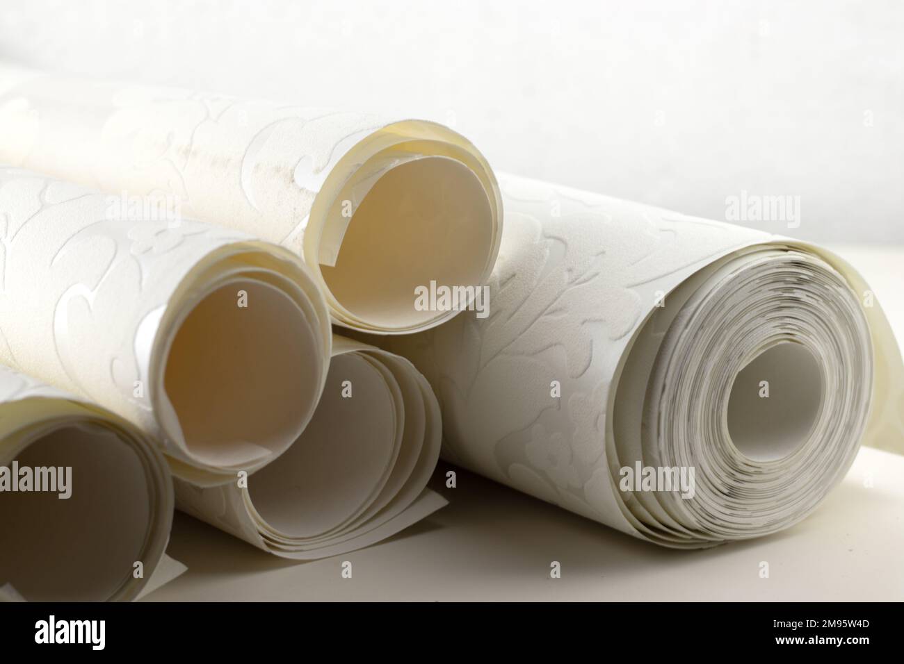 A closeup shot of a stack of wallpaper rolls for walls Stock Photo - Alamy