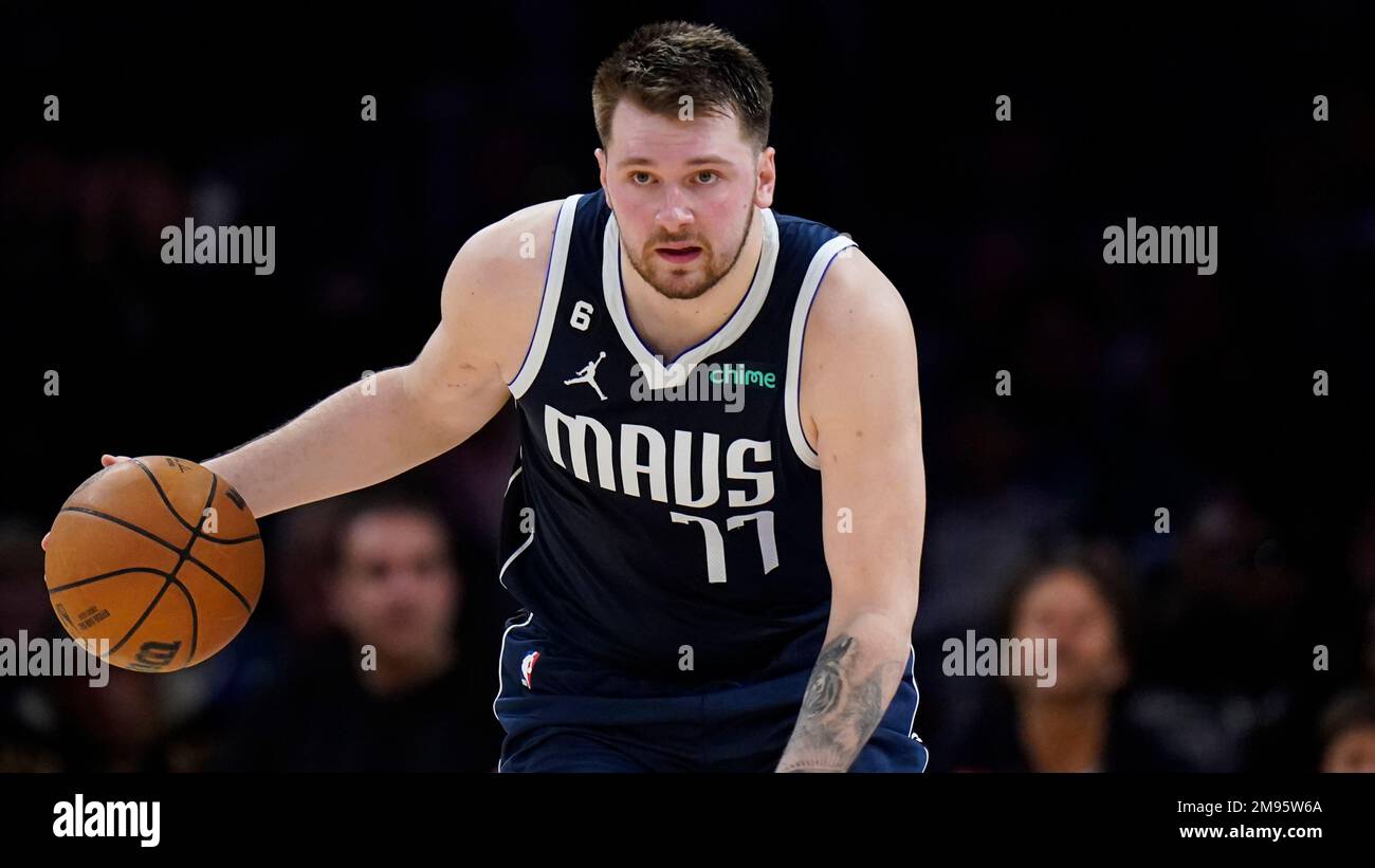 Dallas Mavericks' Luka Doncic (77) dribbles during an NBA basketball ...