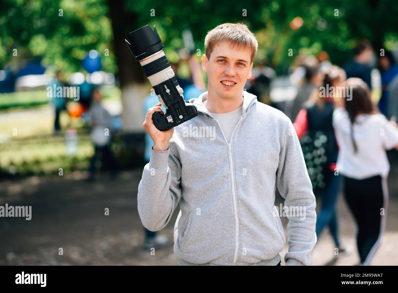 VICHUGA, RUSSIA - JUNE 24, 2017: Photographer with a professional ...