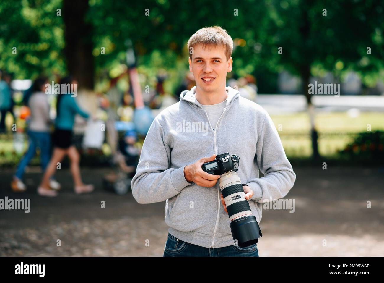 VICHUGA, RUSSIA - JUNE 24, 2017: Photographer with a professional ...