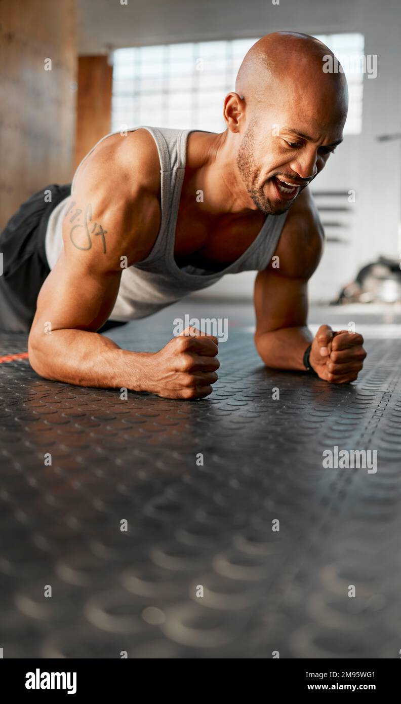Going to a place of meditation. a young man completing a plank session ...
