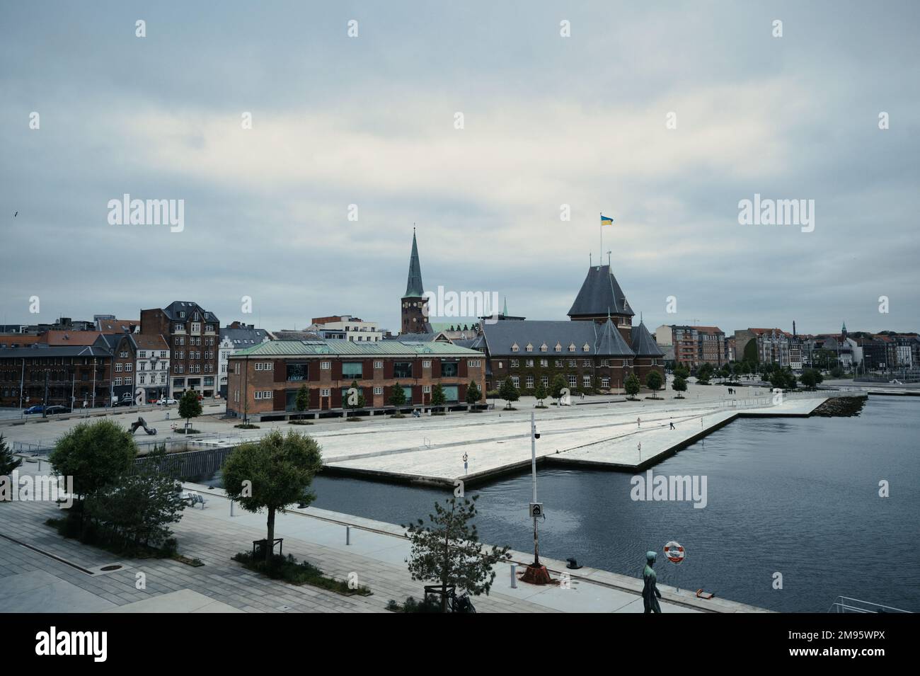 A drone view of the Aarhus waterfront with many historical buildings ...