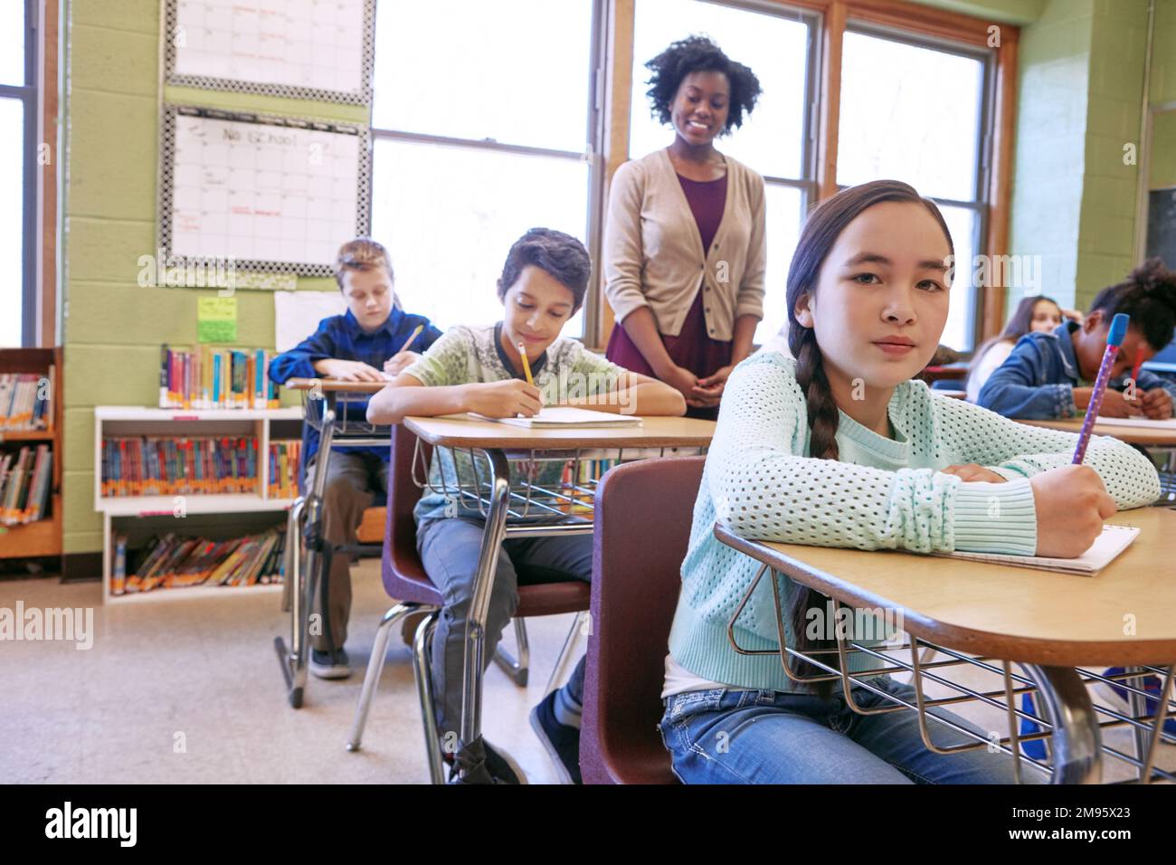 Learning, kids and student portrait in classroom with notebook for ...