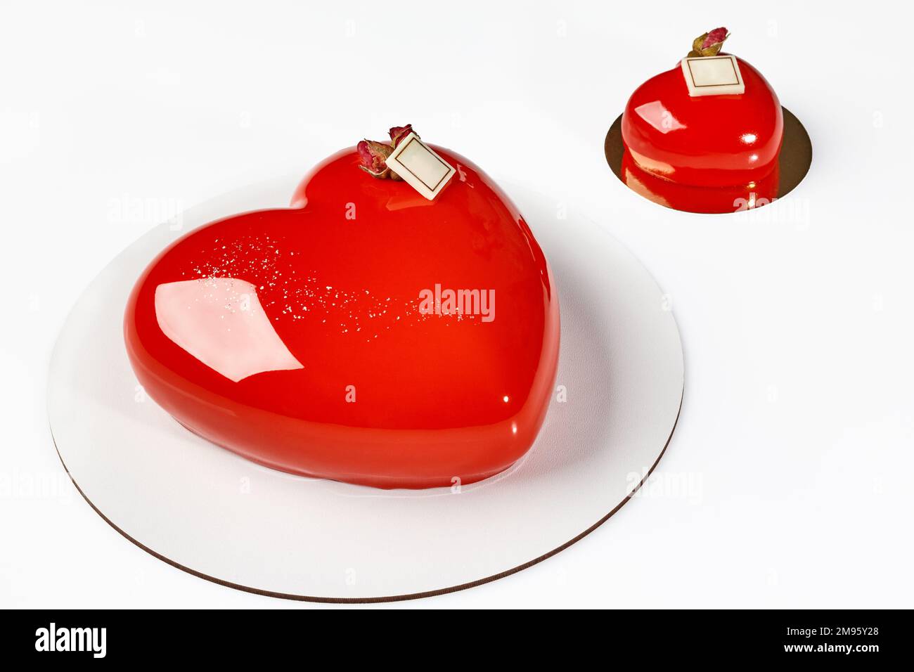 Mousse cake and pastry in shape of hearts with glossy red glaze Stock ...