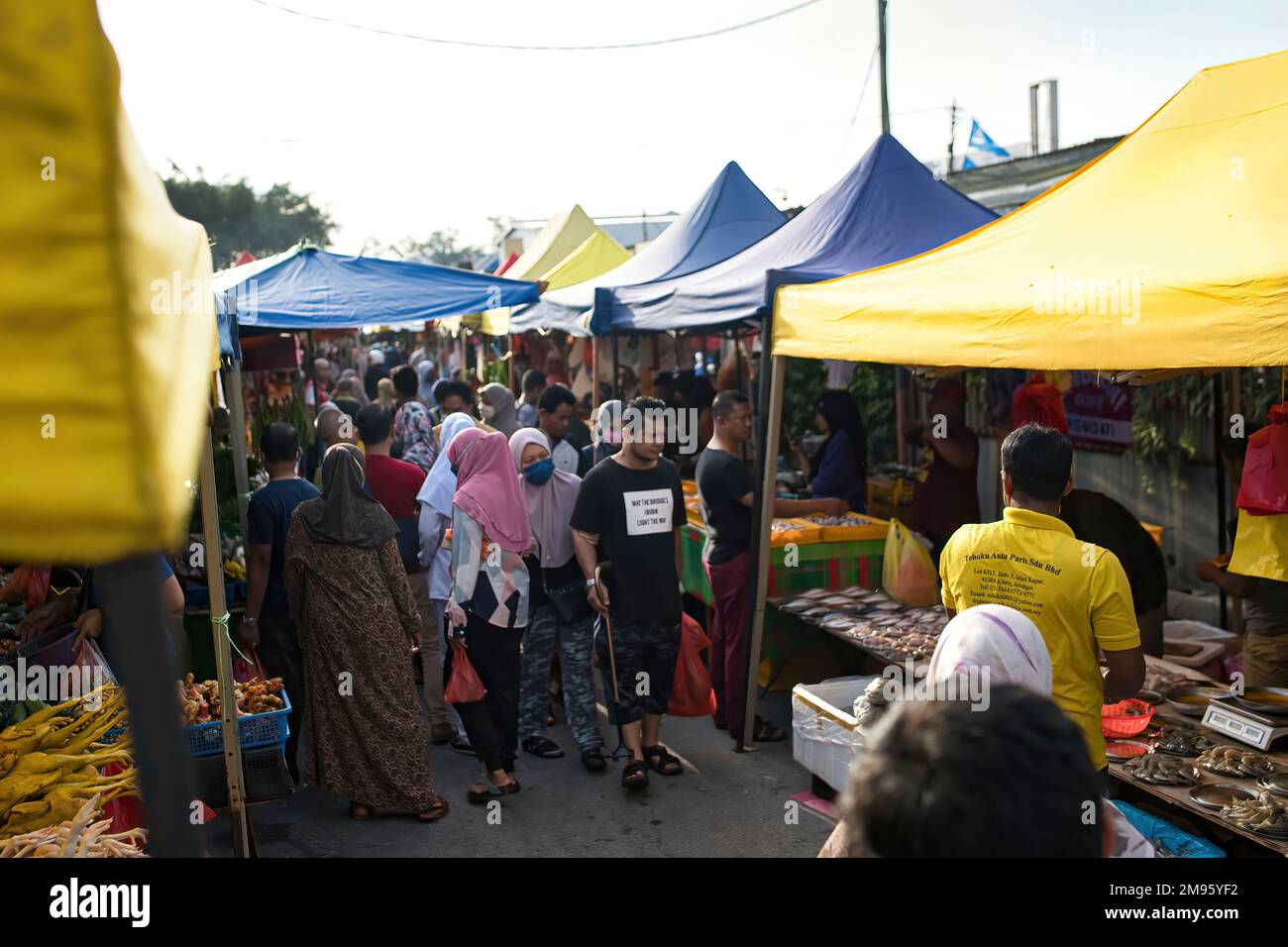 A morning market with locals buying groceries and food in Kuala Lumpur ...
