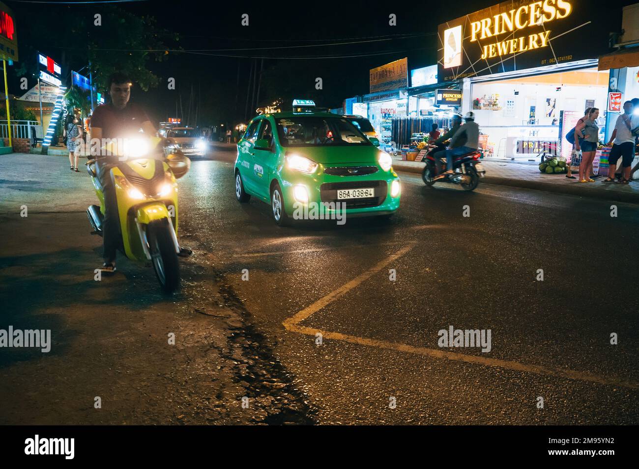 MUI NE, VIETNAM - CIRCA MARCH 2017: Traffic on the street at night on ...