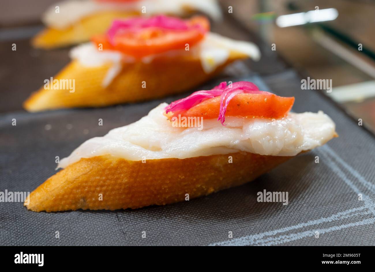Typical snack of Basque Country, pinchos or pinxtos, small piece of ...