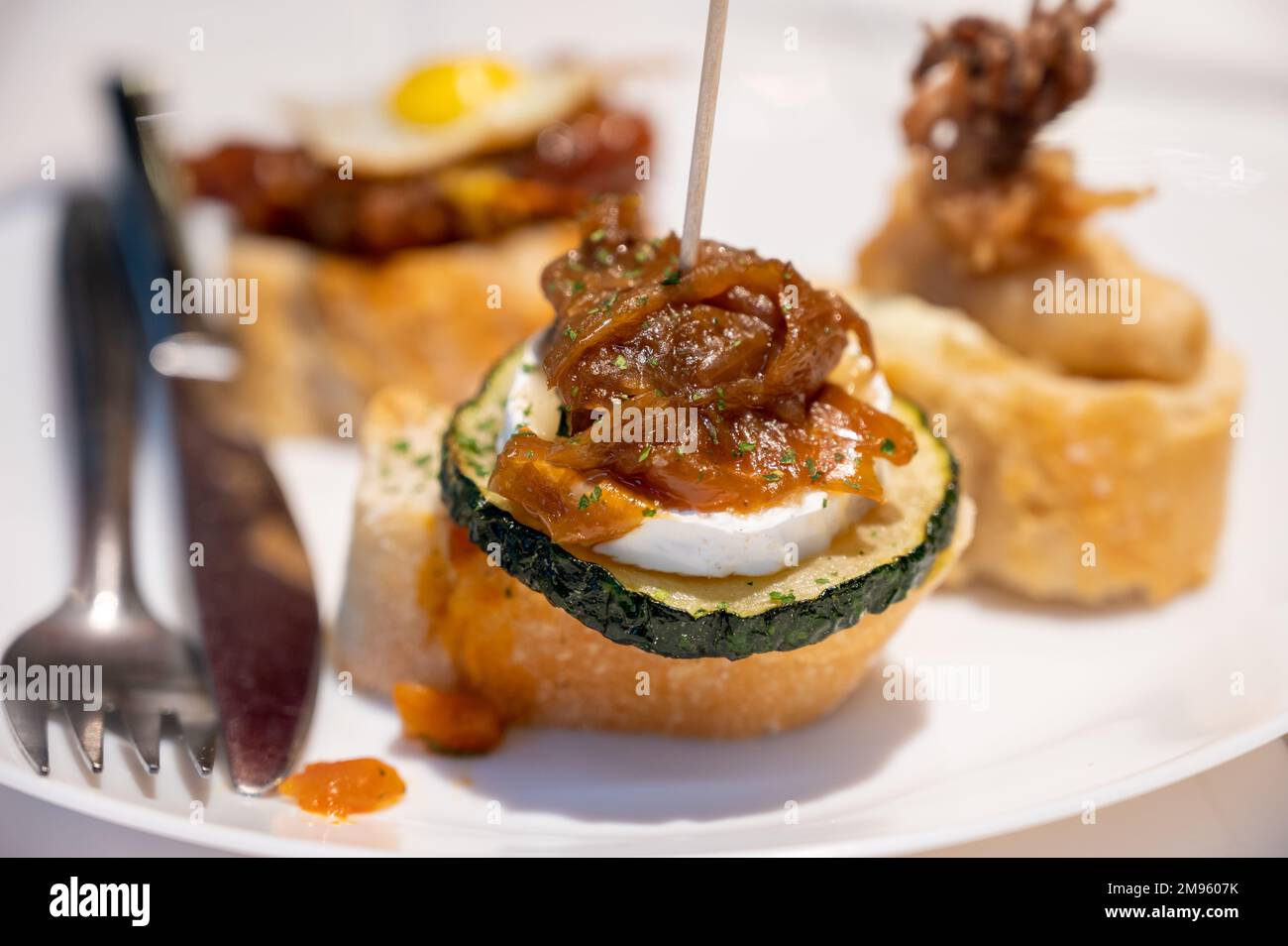White board with typical snack of Basque Country, pinchos or pinxtos ...