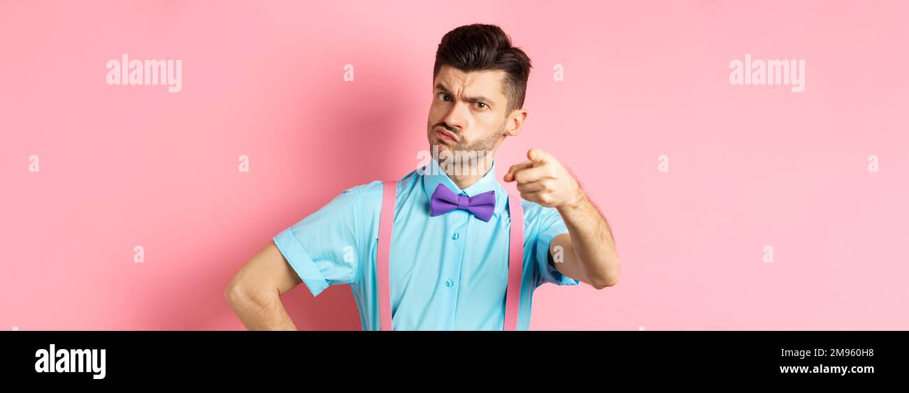 Grumpy guy in bow-tie and suspenders accusing you, its your fault ...