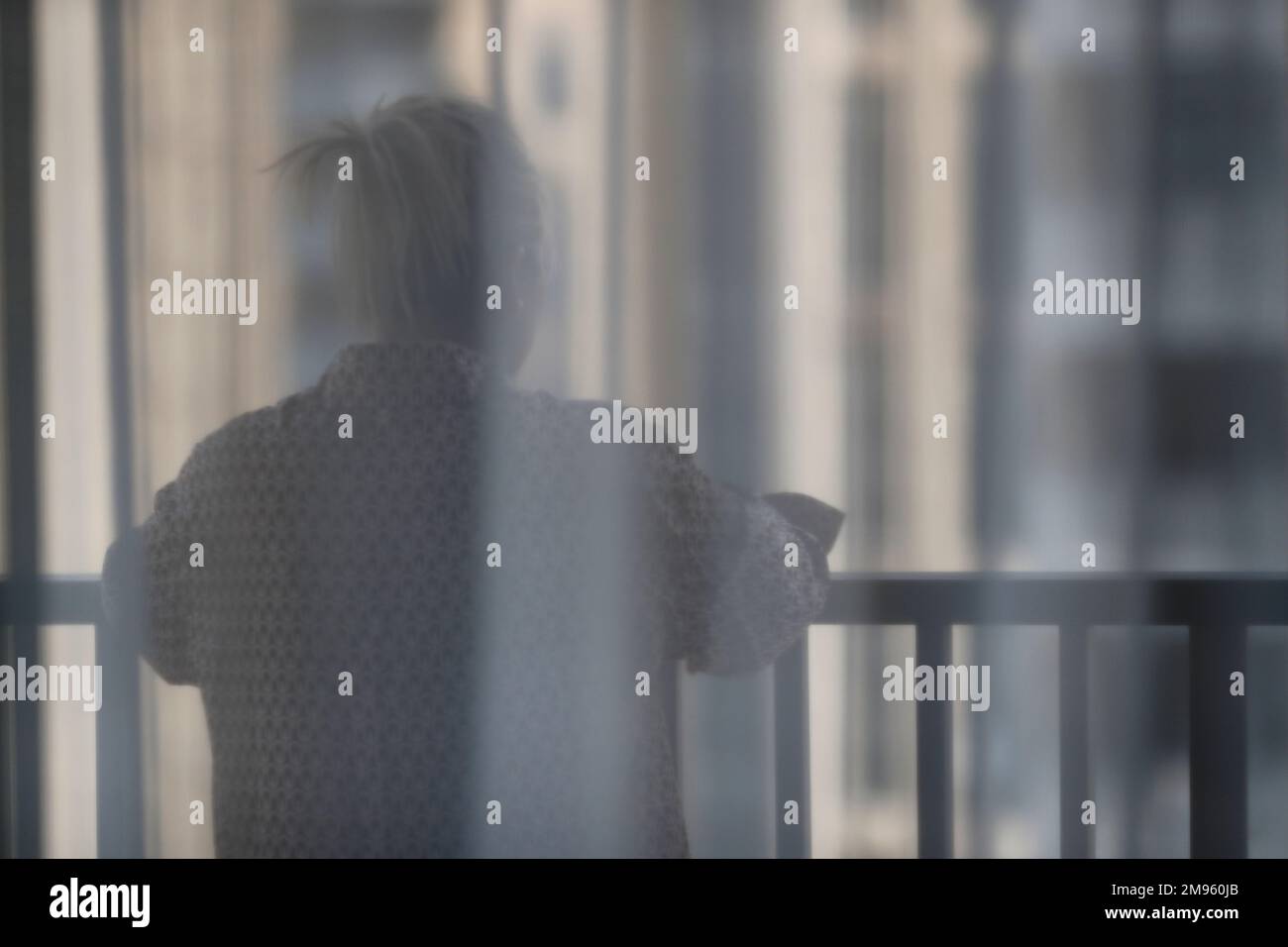 Silhouette of a woman behind a semi transparent curtain Stock Photo - Alamy