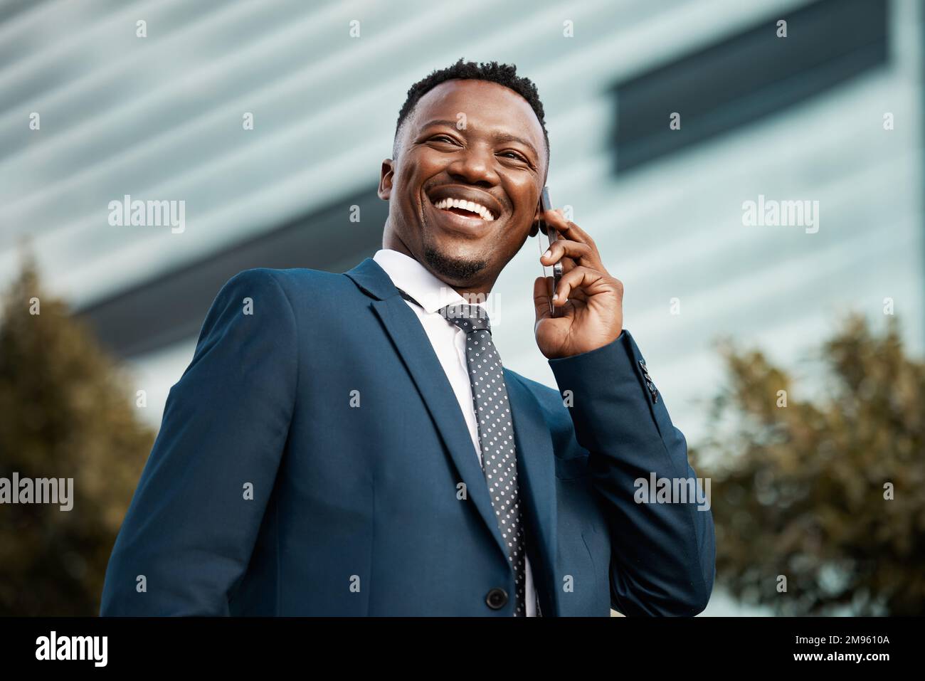 Its been far too long. a handsome young businessman using his ...