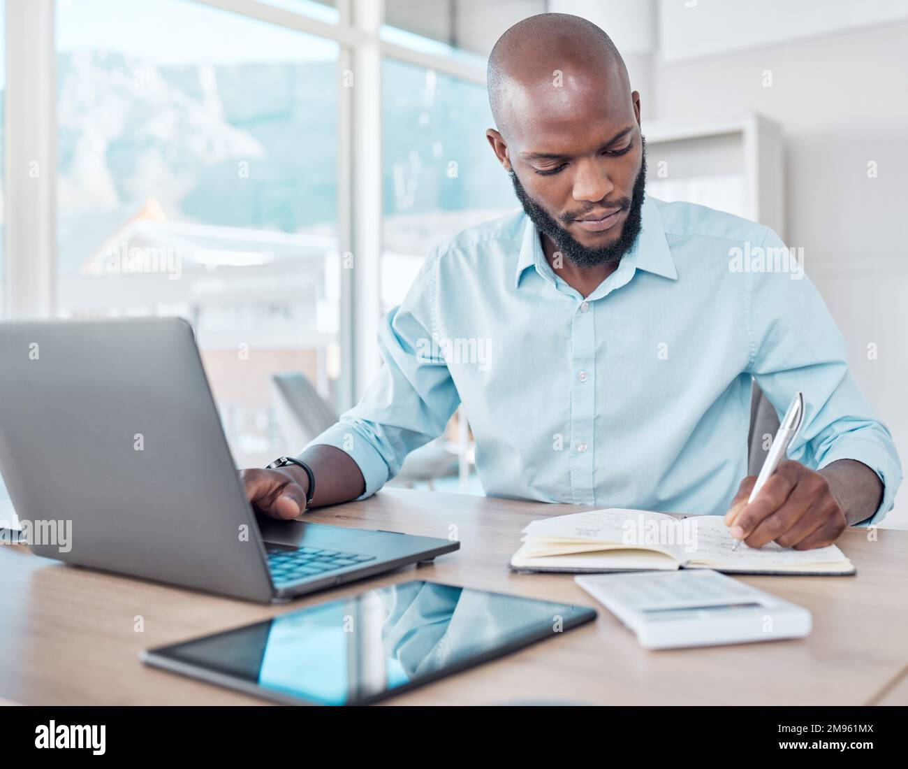 Serious young man making notes hi-res stock photography and images - Alamy