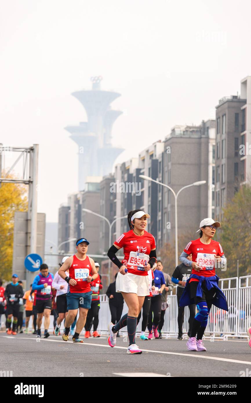 A vertical shot of the Beijing marathon scene with a background of the ...