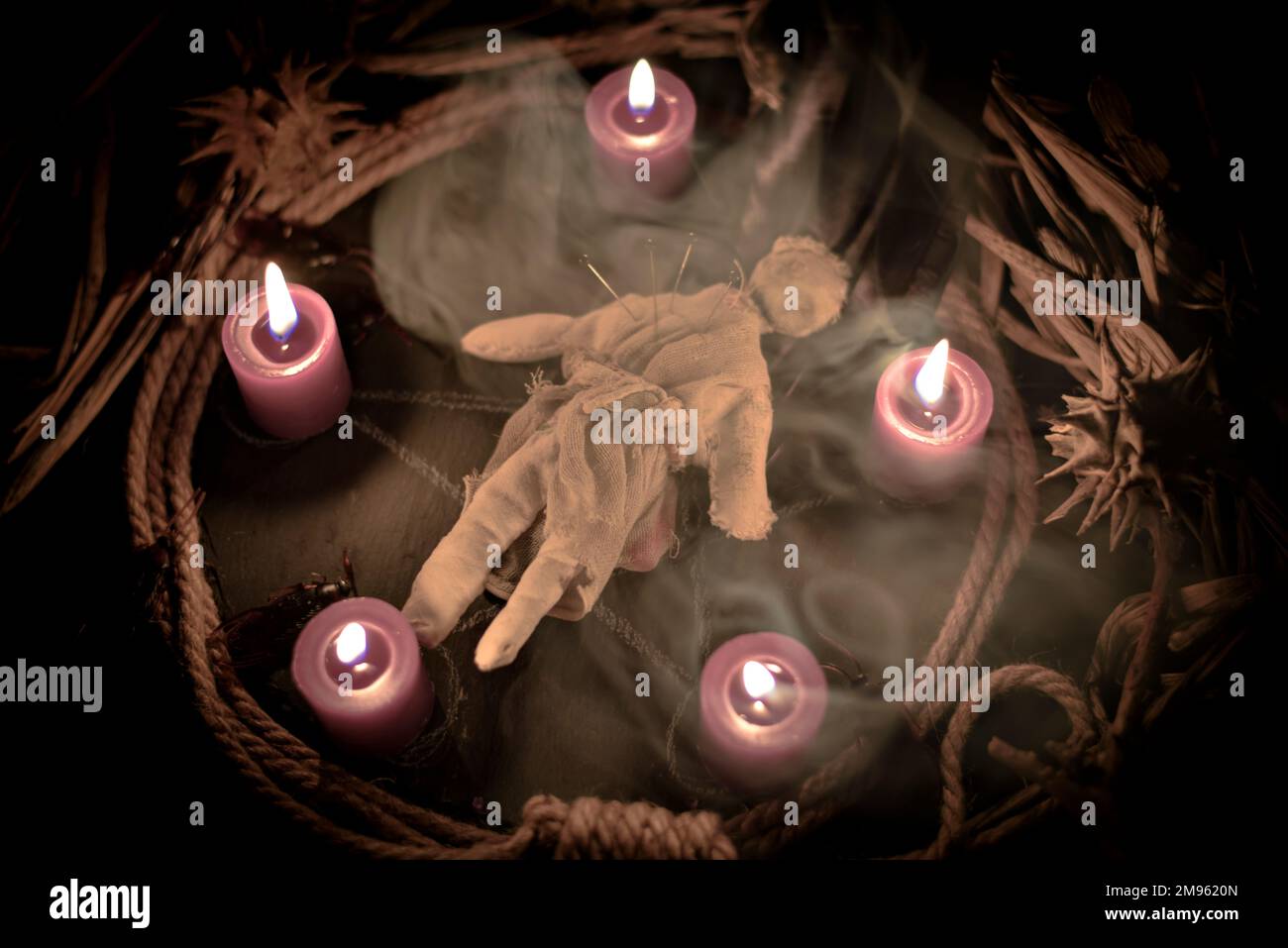 Pentagram amulet and black candle in autumn forest, natural background ...