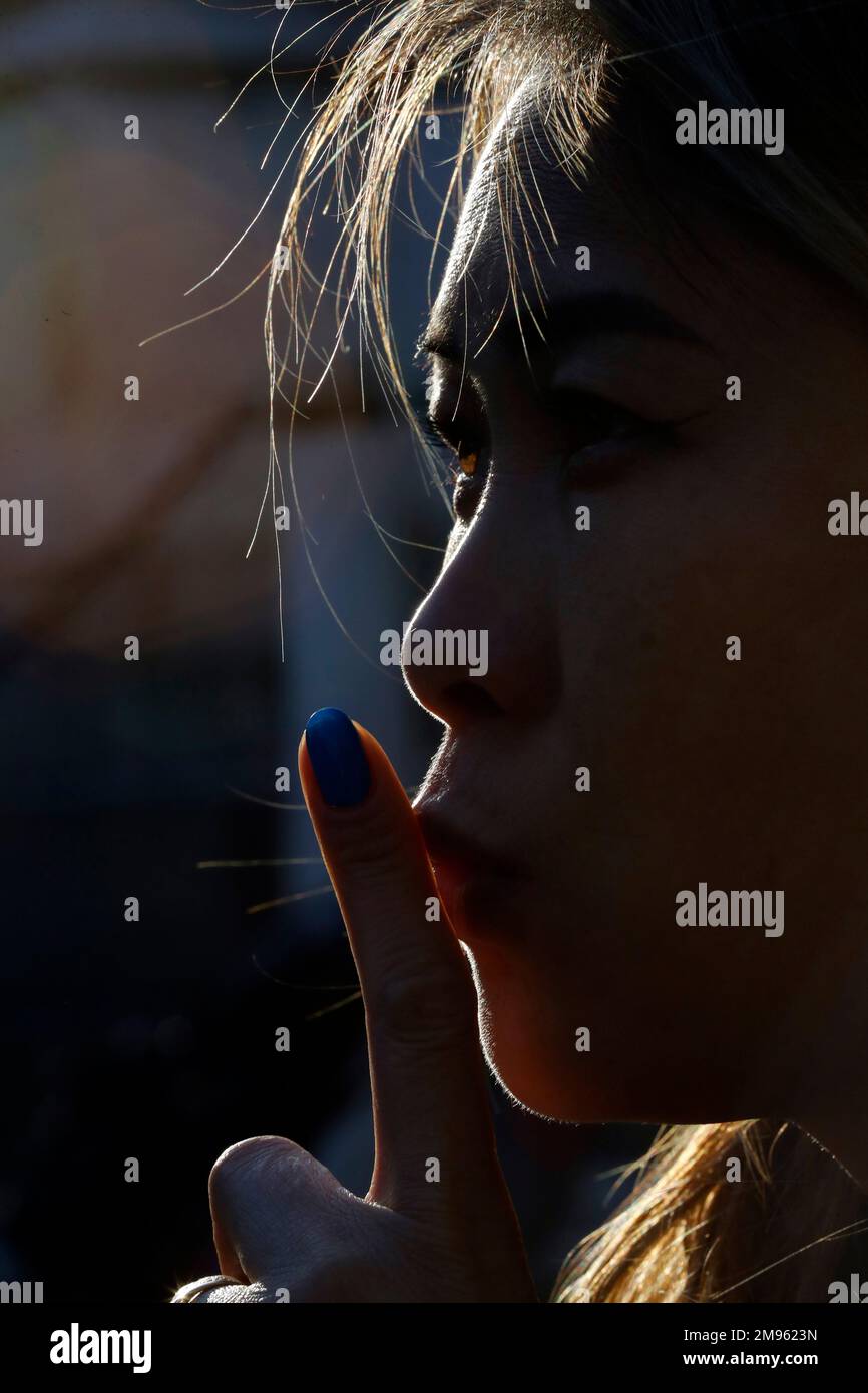 Profile view of silhouette woman standing outside during sunset Stock ...