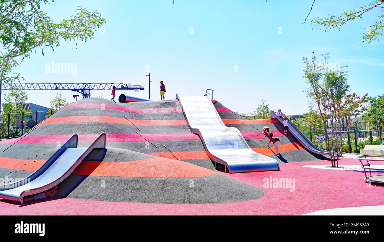 slides and swings in a playground in a neighborhood of Barcelona ...