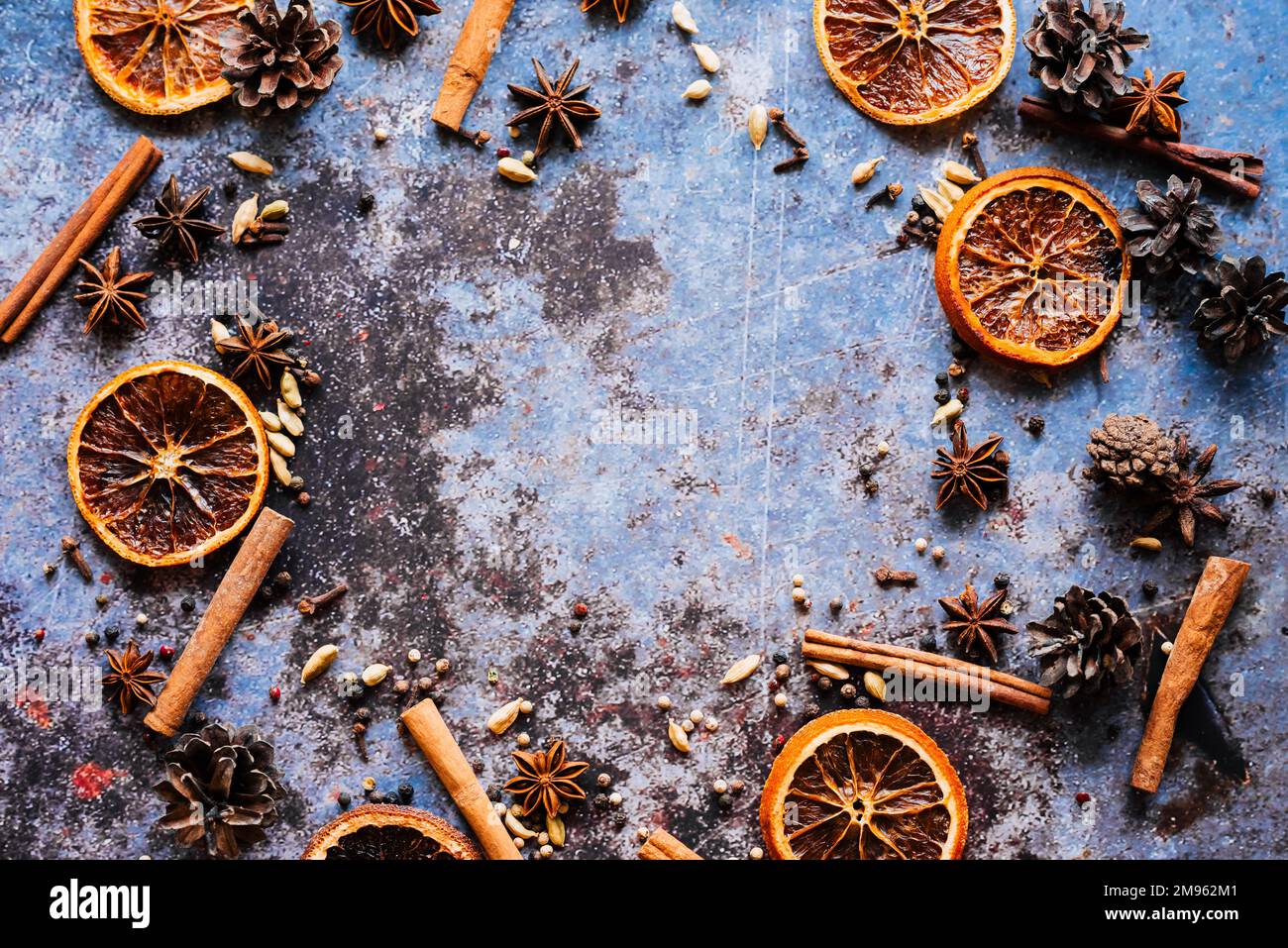 Frame spices. Dried orange, cinnamon sticks, anise star, cardamom ...