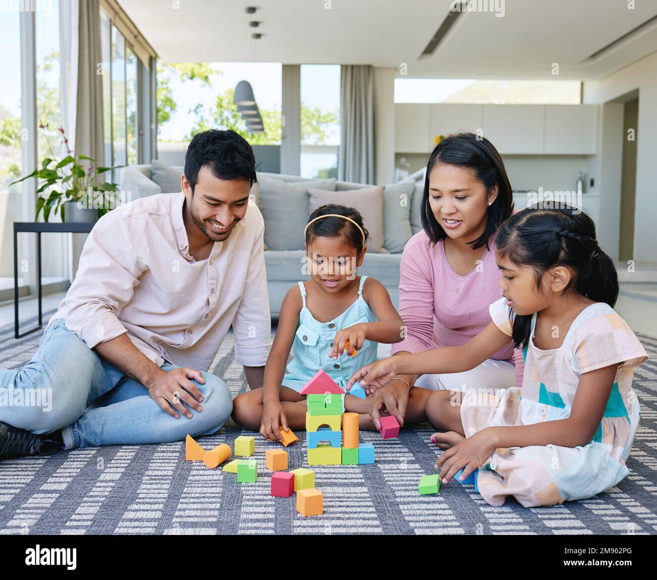 Developing their minds from a young age. a young couple playing with ...