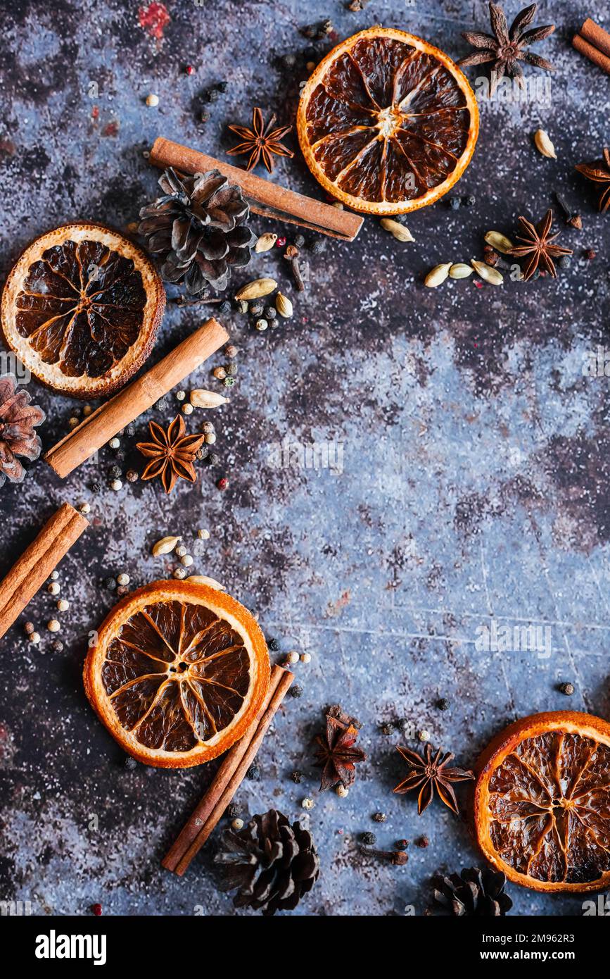 Frame spices. Dried orange, cinnamon sticks, anise star, cardamom ...