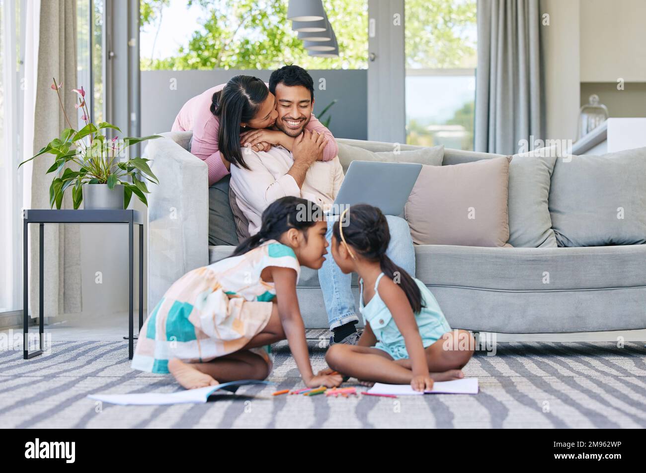 Family life is the best life. two sisters playing together while their ...