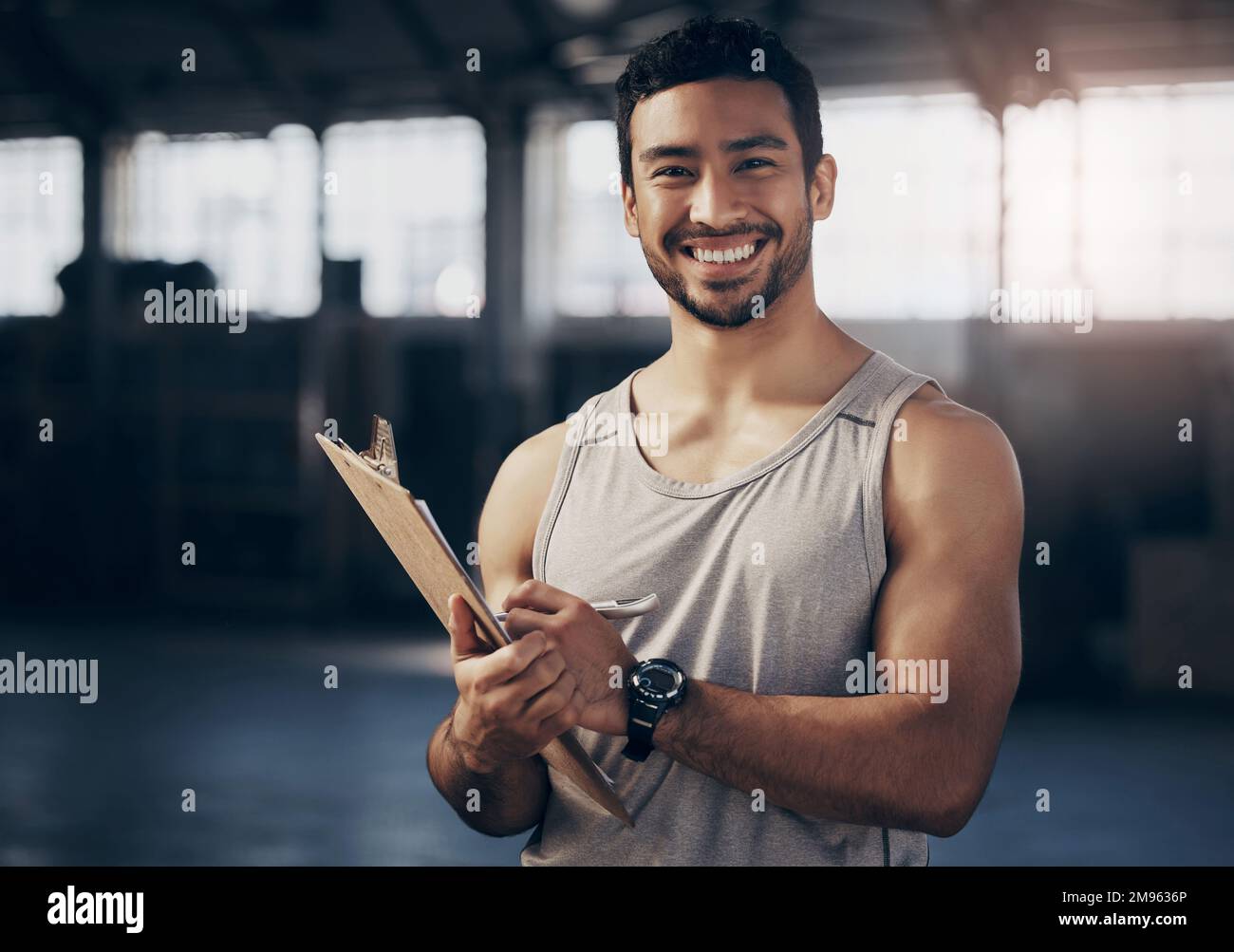 Ill help you fill out a membership form. Portrait of a muscular young ...