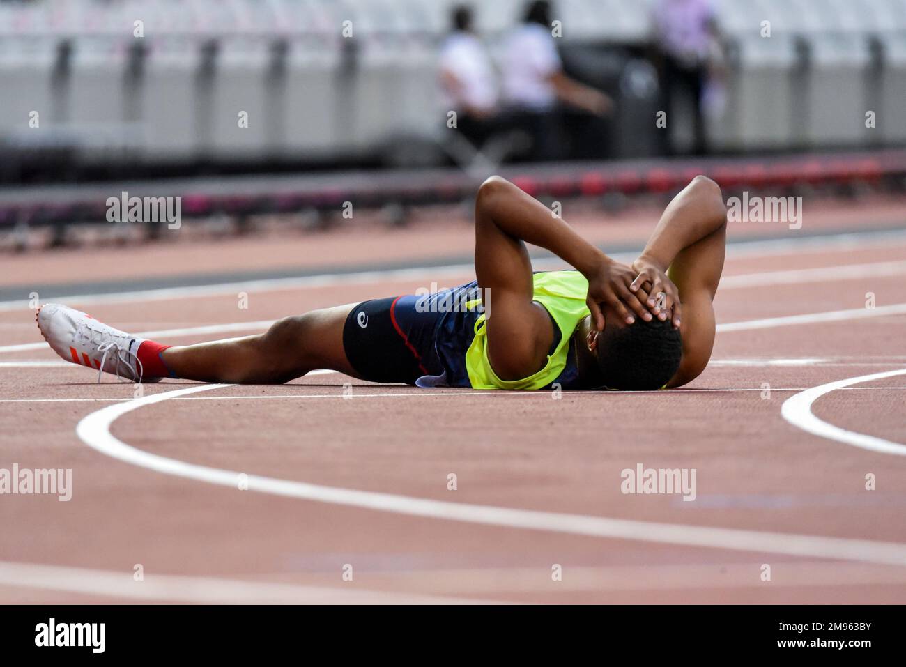 Collapsed guide athlete after competing in 400m T11 at the 2017 World Para Athletics ...